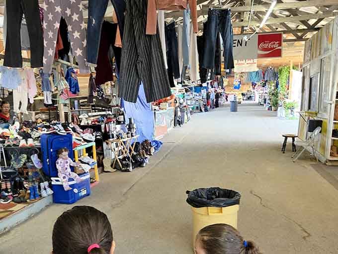 Vintage Coca-Cola signs and clothing racks create a nostalgic atmosphere where past meets present in delightful ways.