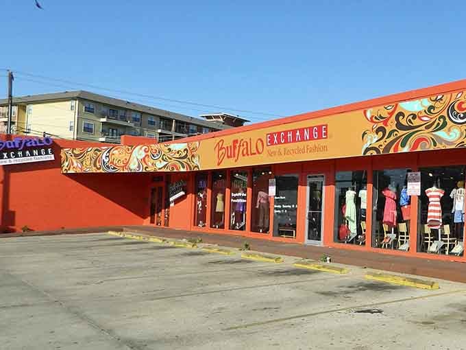 That psychedelic orange facade with swirling patterns makes this Austin spot look like Woodstock met a thrift store wonderland.