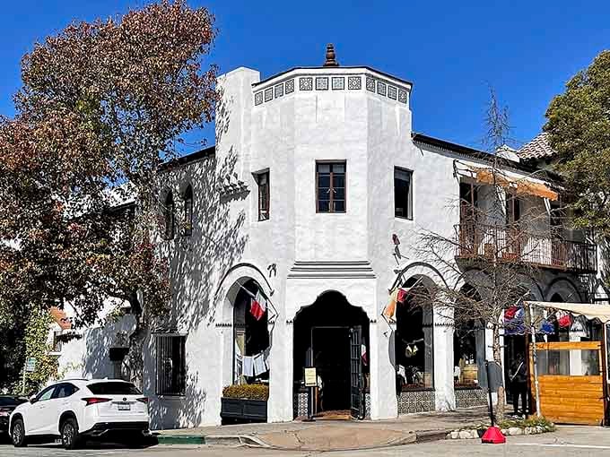 This white Spanish-style building catches afternoon light like a Mediterranean dream dropped into California's coastal landscape.