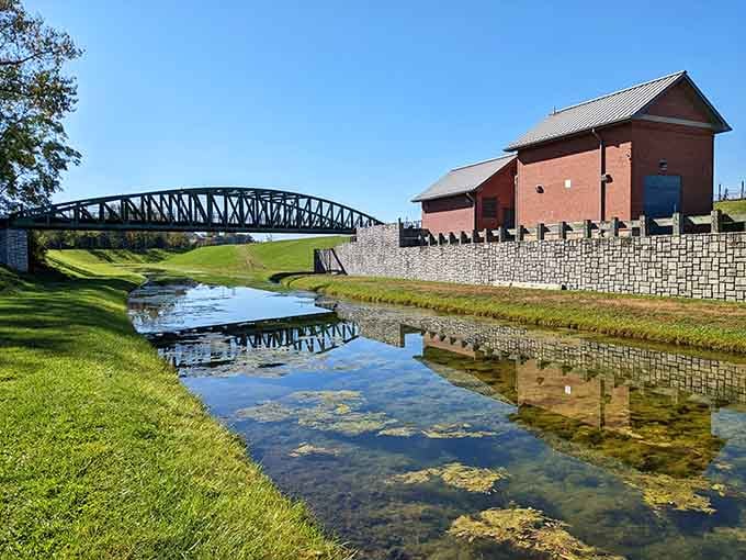 When the canal reflects the bridge and red building perfectly, even Mother Nature stops to admire herself.