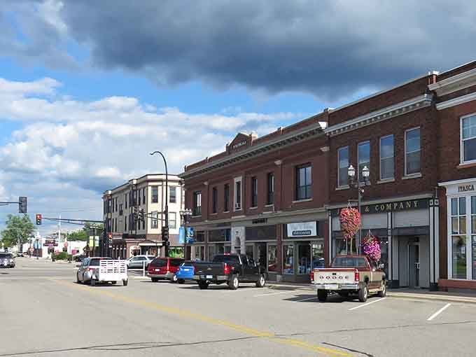 Historic brick buildings stand proud under clouds that look like they're auditioning for a landscape painting.
