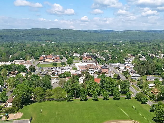 From above, this valley town nestles into green hills like it's been there forever.