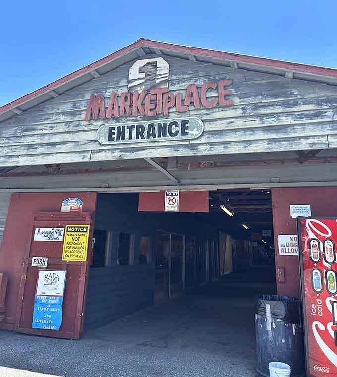 The weathered entrance beckons with vintage charm that promises authentic finds and real conversations with friendly vendors inside.