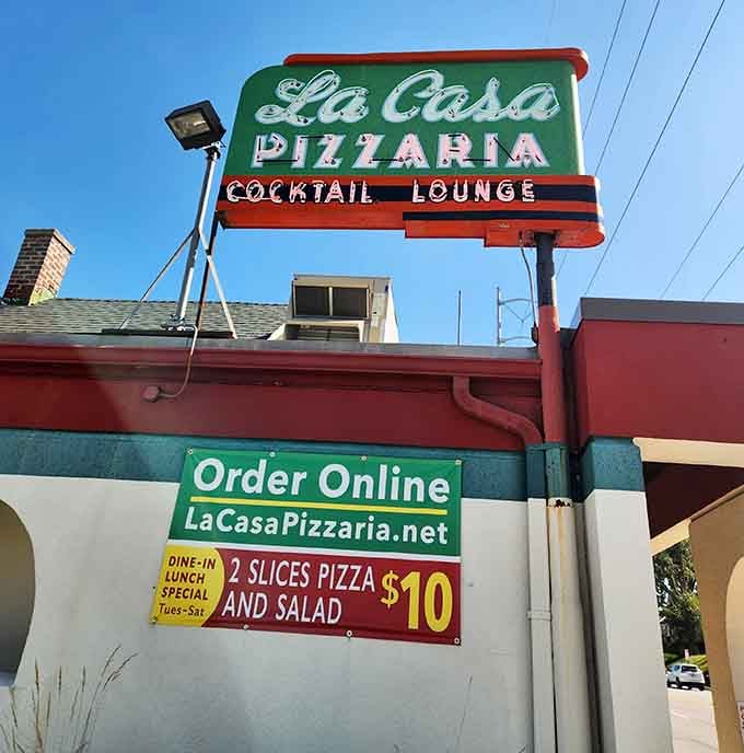 That vintage neon sign has been guiding hungry Nebraskans to pizza nirvana since before TikTok food trends were even a concept.