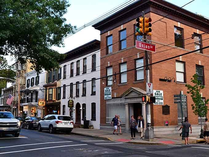 Golden hour light bathes Lambertville's historic streets where art galleries and antique shops create a treasure hunter's paradise.