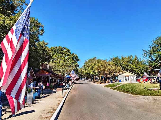 Flags flutter above this charming street where community spirit runs deeper than the creek flowing through town.