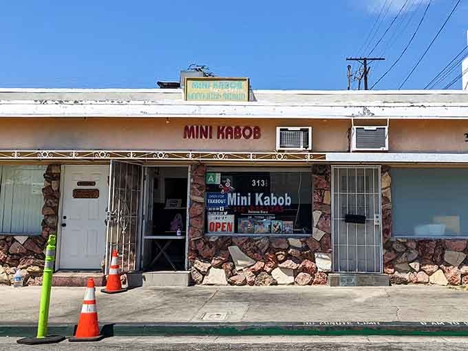 The stone facade and simple signage whisper "neighborhood spot," but the grilled kabobs inside absolutely sing with flavor.
