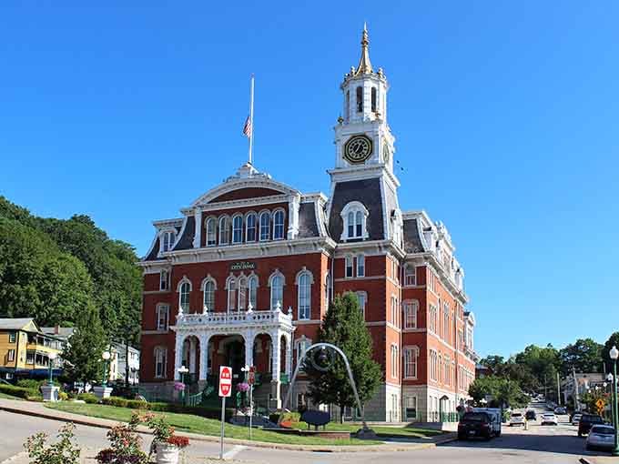 That clock tower commands attention like a New England postcard, standing tall against blue skies with timeless architectural grace.