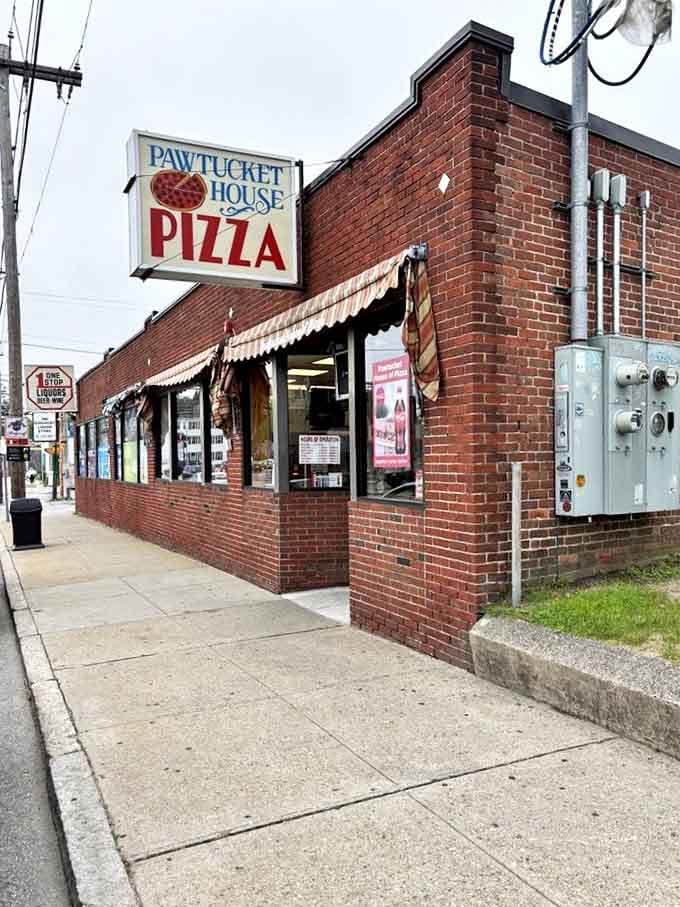 Red brick and striped awnings: the universal language of "serious pizza happens here, folks."