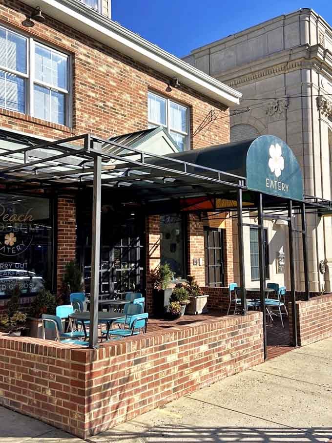 The Peach Blossom's charming brick facade whispers promises of farm-fresh goodness and homestyle comfort waiting inside.