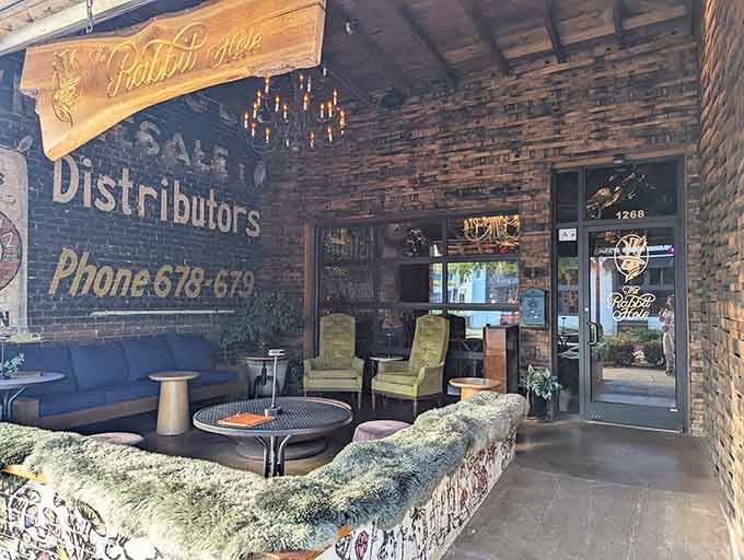 Vintage brick walls and ghost-painted windows create an atmosphere where Alice herself would feel perfectly at home here.