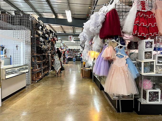 Those fancy dresses hanging like a fairy tale wardrobe remind you that someone's special occasion is waiting to happen.