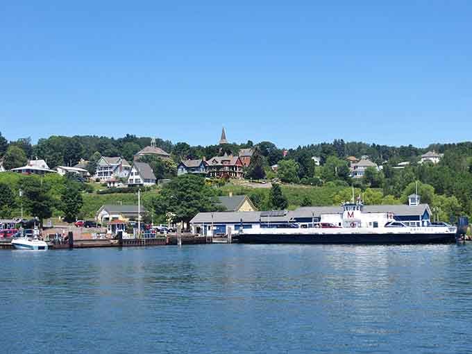 Boats bob gently in the harbor while the hillside village watches over them like a protective parent.