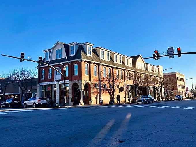 Elegant architecture and vibrant storefronts stand proudly at the corner, offering a welcoming atmosphere for all who pass by.