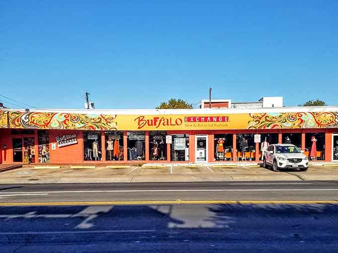 The colorful storefront practically dances in the sunshine, inviting you to discover vintage gems hiding behind those cheerful windows.