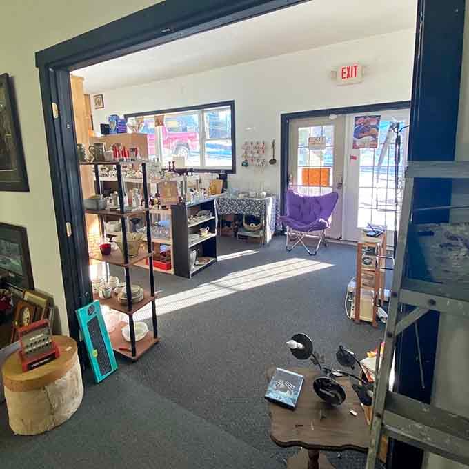 Sunlight streams through the doorway, illuminating a carefully curated space where antique lovers find their happy place.