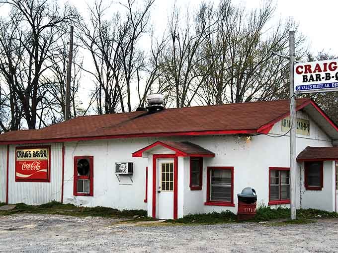 Red trim and a simple sign mark the spot for barbecue pilgrims. No fancy frills needed when the smoke ring on your brisket speaks volumes.