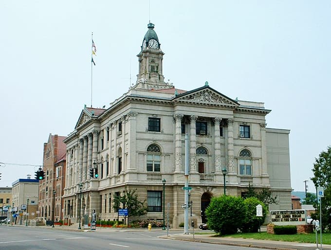 This grand Elmira City Hall with its classical columns and clock tower commands respect like a judge entering the courtroom.