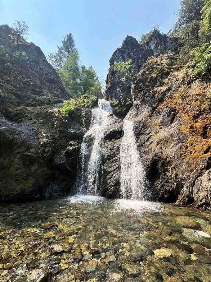 The crystal-clear pool at the base invites you to dip your toes, though fair warning, it's colder than expected.