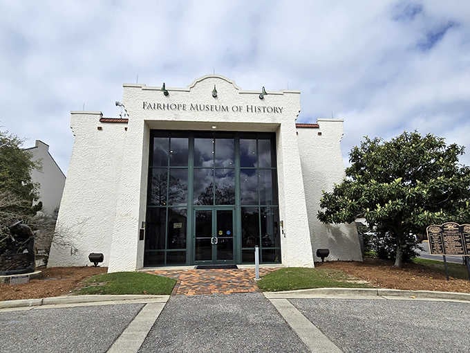 The Fairhope Museum of History welcomes visitors with its striking white facade, a treasure trove of local stories waiting to be discovered.