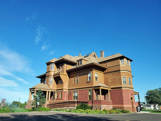 Morning light bathes Fairlawn's regal silhouette in golden warmth. This Superior mansion truly lives up to its name!