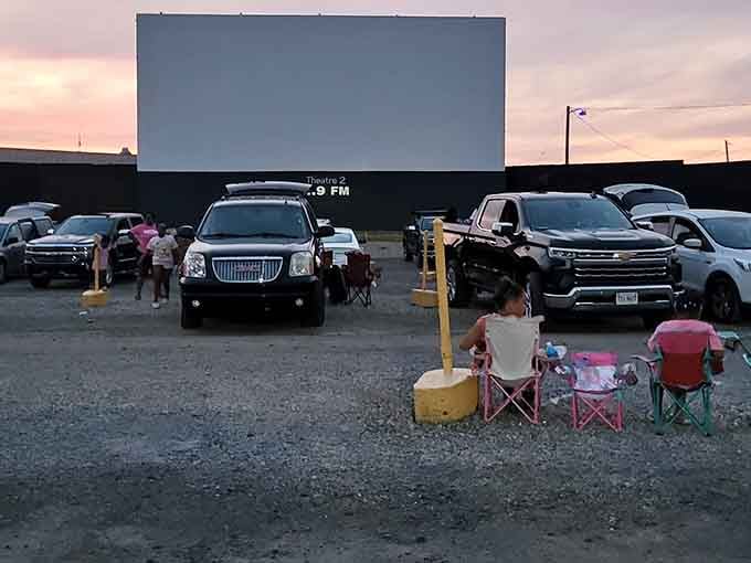Lawn chairs and little ones create the perfect pre-show scene as twilight settles over this beloved gathering place.