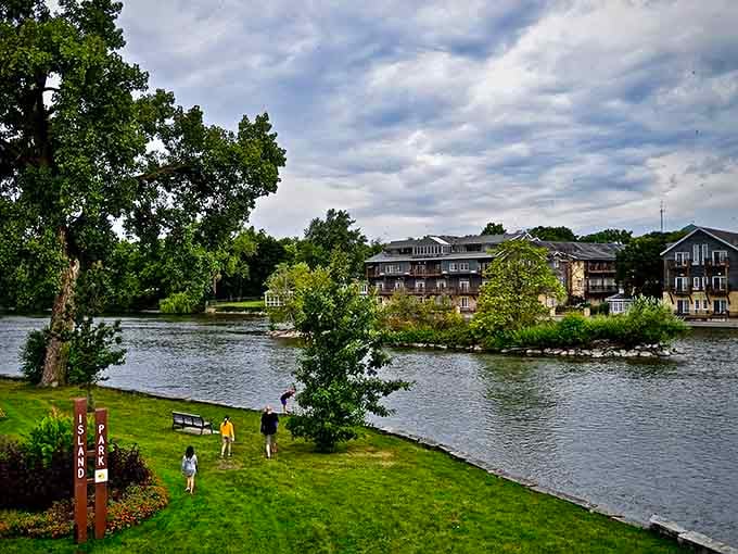 The Fox River flows past like a liquid mirror, reflecting buildings and trees in perfect small-town harmony and peace.