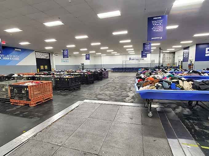 Mountains of colorful clothing spread across tables like a rainbow exploded in the best possible way.