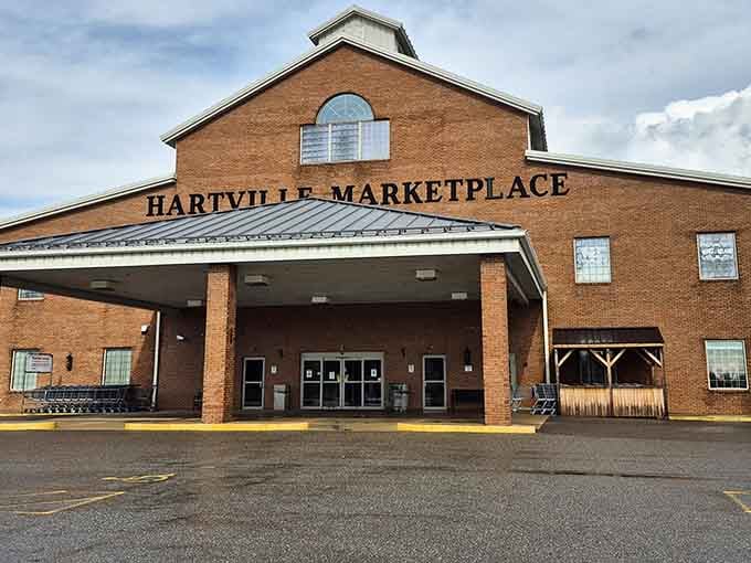 The impressive brick facade welcomes bargain hunters like a grand theater entrance for the shopping enthusiast.