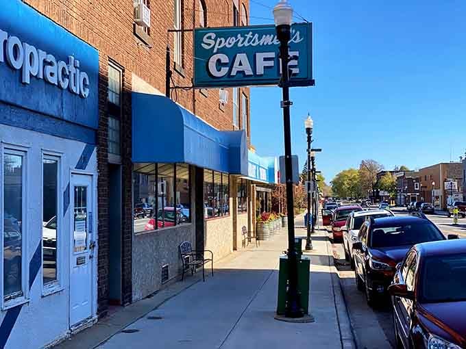 That vintage Sportsmen's Cafe sign beckons like a beacon to anyone who appreciates authentic small-town character and good company.