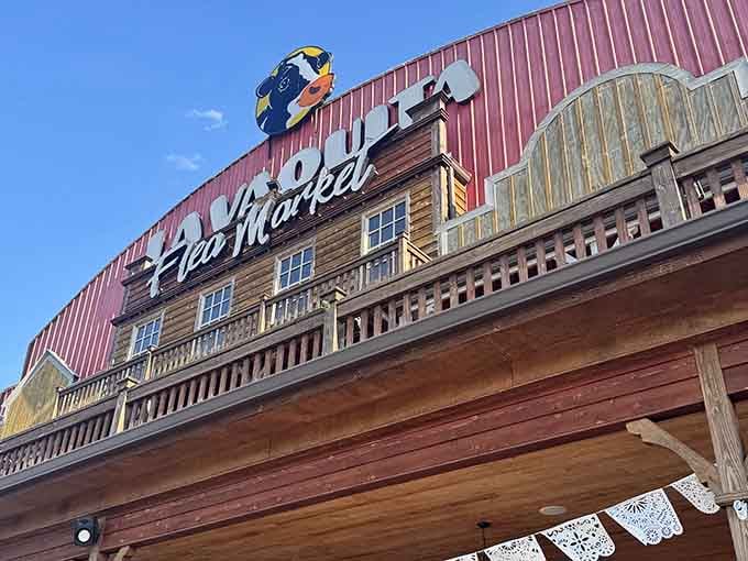 Blue sky meeting rustic wood architecture proves even flea markets can have serious curb appeal and character.