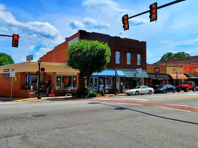 Blue awnings and bustling sidewalks prove small-town charm and vibrant community life go hand in hand beautifully.