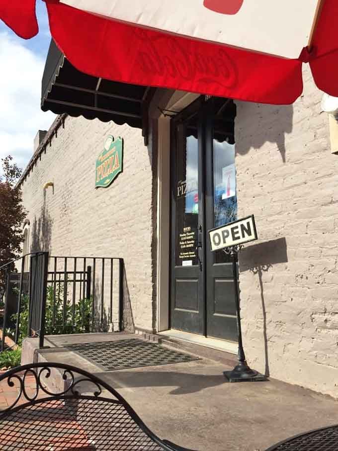 That classic red awning signals what locals already know: small-town charm, big-time flavor awaits inside.