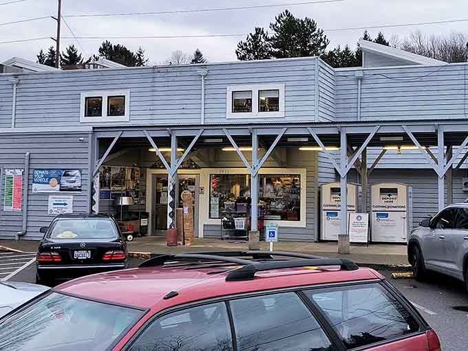 Those distinctive white crossbeam supports frame the doorways like a covered bridge leading to bargain wonderland.