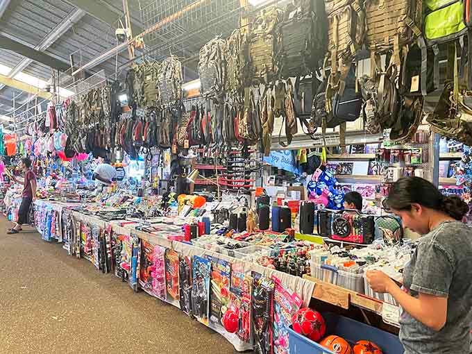 Rows of camouflage gear hanging overhead suggest this market knows exactly what outdoor enthusiasts need for weekend adventures.
