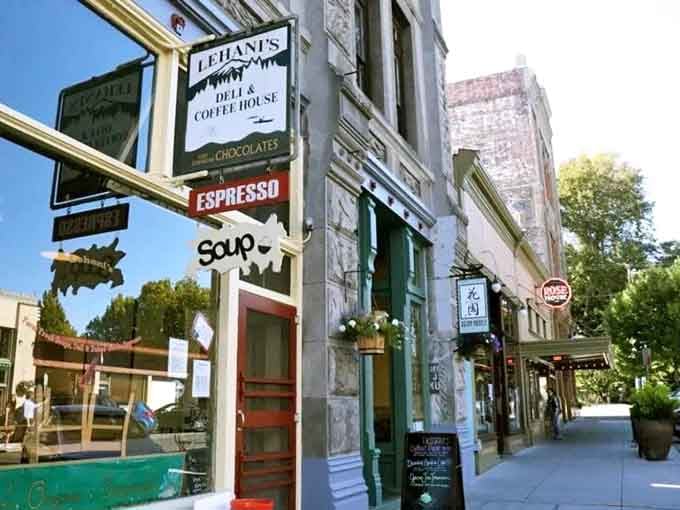 Historic storefronts line the sidewalk where coffee shops and delis beckon with promises of good conversation and better sandwiches.