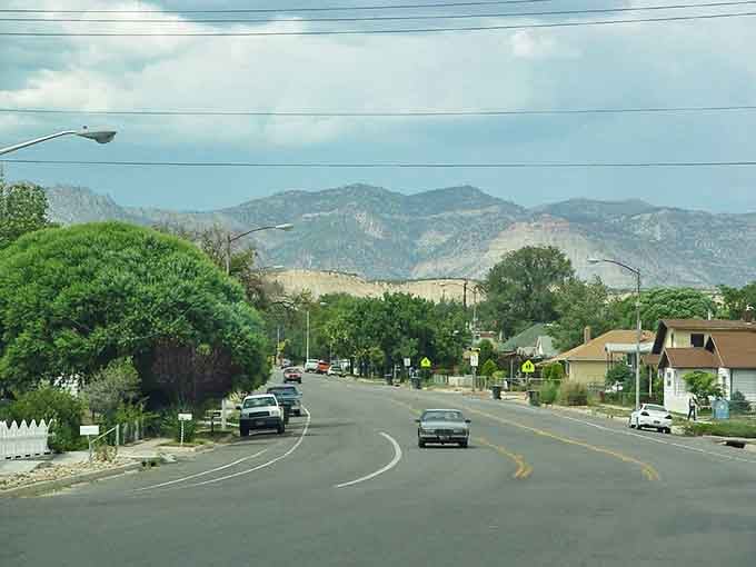 Residential streets curve gently past modest homes where your Social Security check actually covers the mortgage payment.