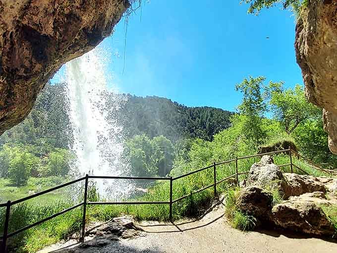 Standing behind the cascading curtain of water feels like discovering your own secret grotto in the mountains.