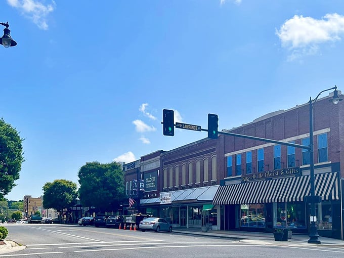 Those striped awnings and historic storefronts could be straight from a Norman Rockwell painting come to life.