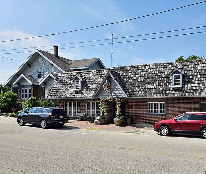 The shingled roof and flower-adorned entrance hide the carnivorous paradise waiting inside this New Holstein gem.