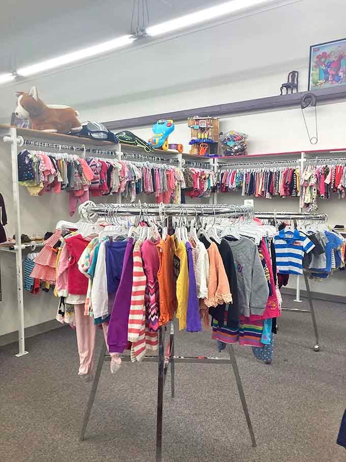 Rainbow racks of children's clothing await new homes &ndash; each tiny garment with stories yet to be written.