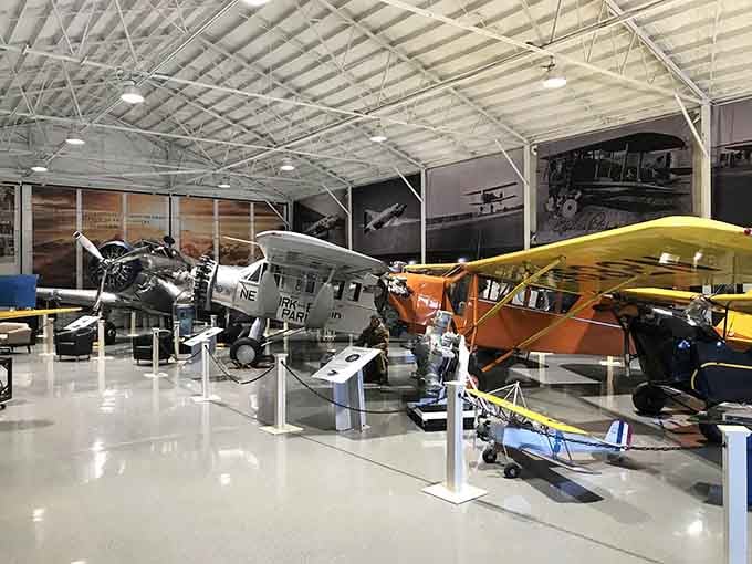 Inside, vintage aircraft rest like sleeping giants, each one preserving decades of aviation heritage beautifully.