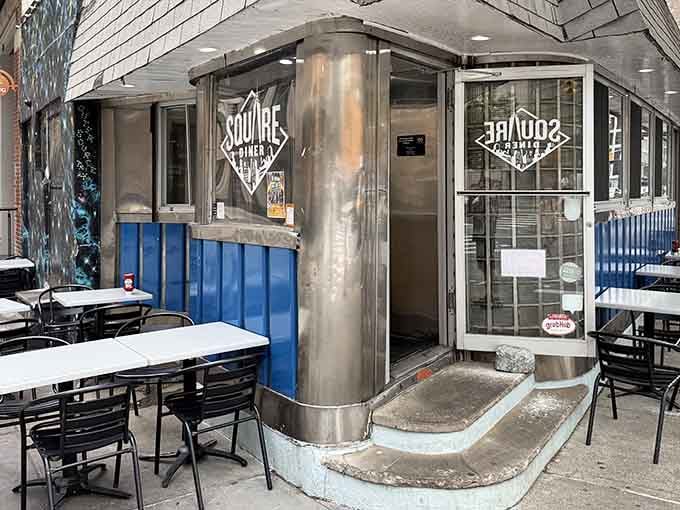 The chrome-trimmed entrance to Square Diner beckons like a portal to simpler times. Inside, pancakes flip with the same rhythm they did decades ago.