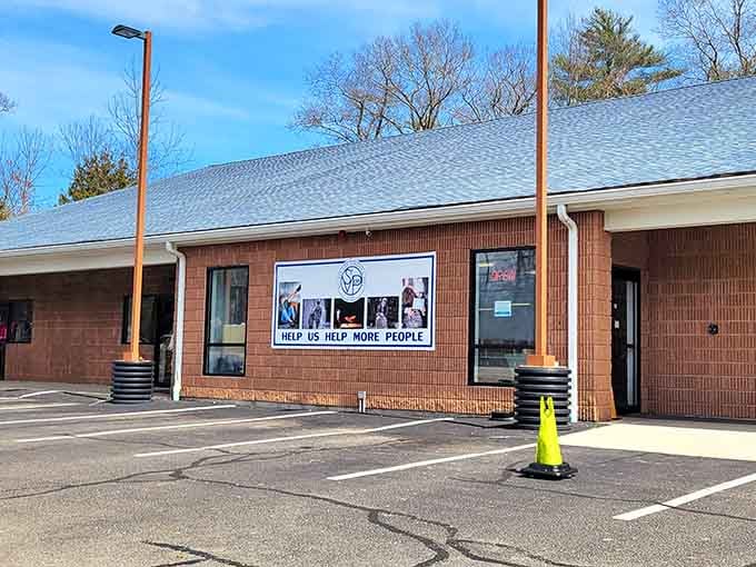 That classic brick building with its mission statement visible through the windows shows shopping here supports your neighbors too.