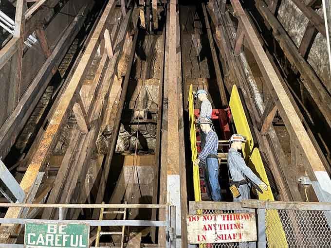 Looking up into the mine shaft reveals the wooden framework that supported countless underground journeys into glowing mineral deposits.