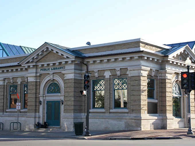 This elegant public library building stands proud with classical columns, proving small towns take their culture seriously and beautifully.