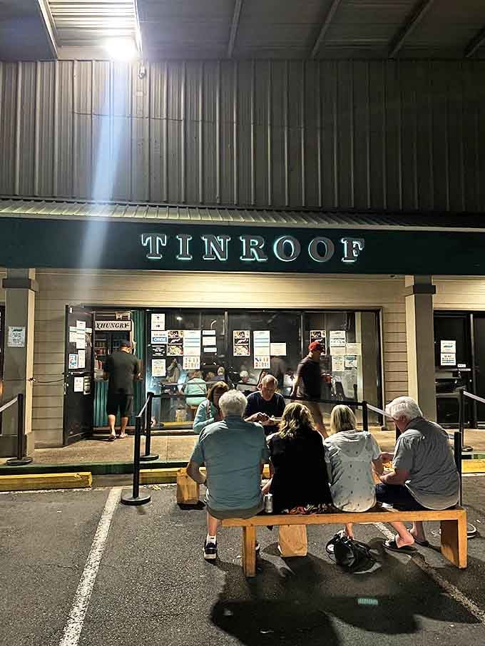 Evening at Tin Roof brings out the devoted food lovers. Those wooden benches have supported countless happy diners waiting for their fix.