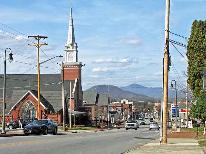 Main Street's historic church spire reaches skyward, while the distant mountains remind you why they call this God's country.