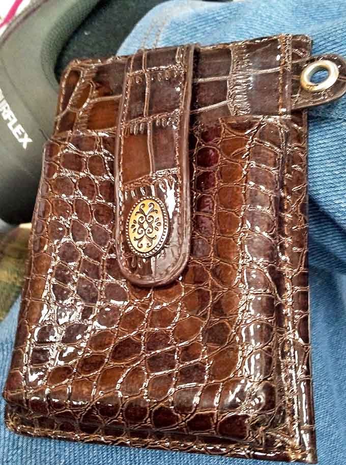 That embossed leather wallet has more character than most people you'll meet at the grocery store checkout line.