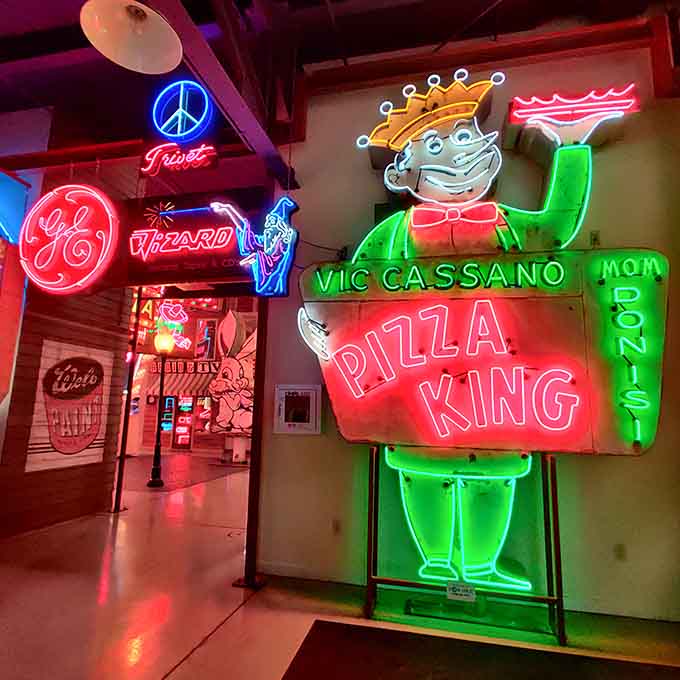The Pizza King sign radiates pure joy, reminding us when cartoon mascots ruled the roadside with personality and charm.